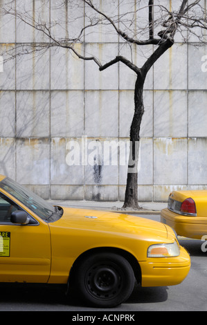 New York City yellow cab taxi parked curbside awaiting passengers near ...