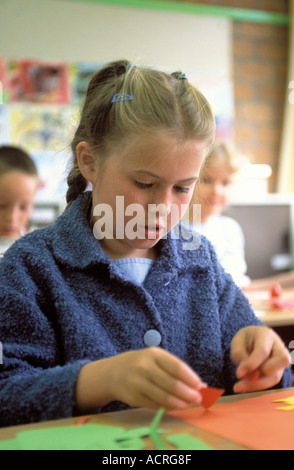 Girl at school doing handicraft Stock Photo - Alamy