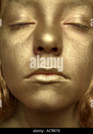half gold face girl nose mouth very closeup saturated Stock Photo - Alamy