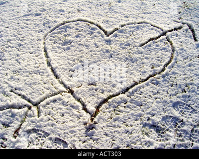 heart in the snow with an arrow is a symbol of eternal love and ...