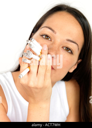 Young Woman Chain Smoking Model Released Stock Photo - Alamy