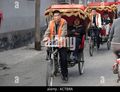 Tour Group of pedicabs in the Hutong, Beijing China Stock Photo - Alamy
