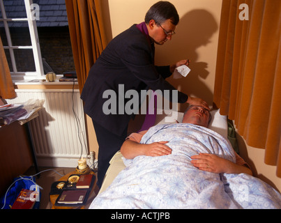 Sacrement Of The Sick Priest Annointing Head Last Rites Stock Photo - Alamy