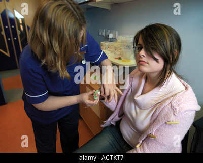 Nurse Dressing Finger at Epsom District Hospital Stock Photo - Alamy