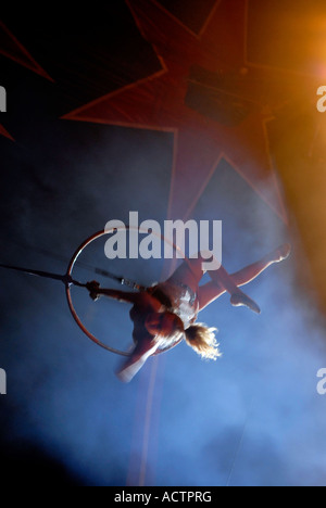Circus acrobat performer using Aerial Hoop also known as "Cerceau" or ...