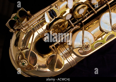 Details of a shiny bronze saxophone close up on white background Stock ...