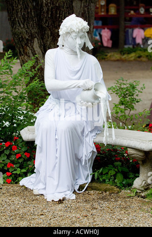 Statue of a woman with a jug of water by a fountain next to Bath Stock ...