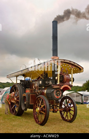 A steam powered traction engine lights up the fairground roundabout at ...