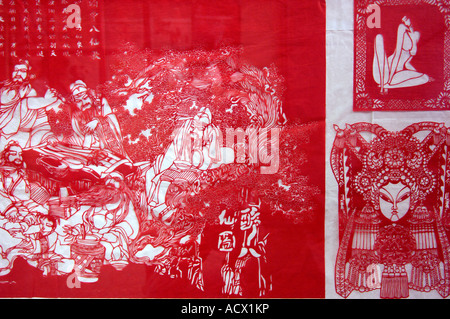 Examples of the ancient art of Chinese paper cutting on sale by the ...