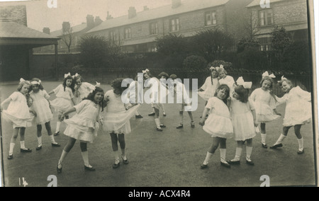 Edwardian children dancing Stock Photo - Alamy