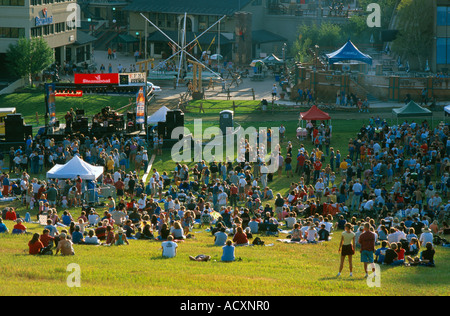 Crowd watching The Radiators play a concert on headwall ski run ...