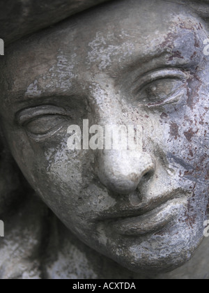 A carved stone face curved in Sandstone on an old gateway building in ...