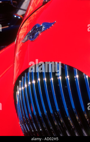 A Morgan 4 Badge And Grill On A Red Morgan Car Stock Photo - Alamy