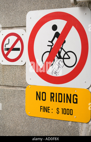 'No riding' signs, Singapore Stock Photo - Alamy