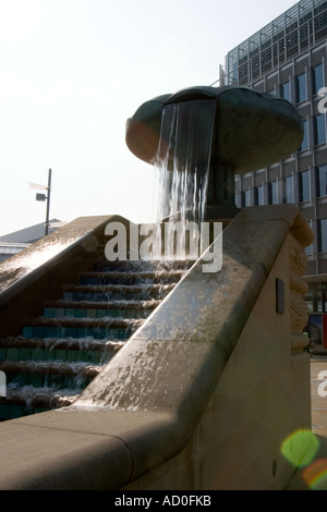 Early spring sunshine on the fountains in Granary Square at Kings Cross ...