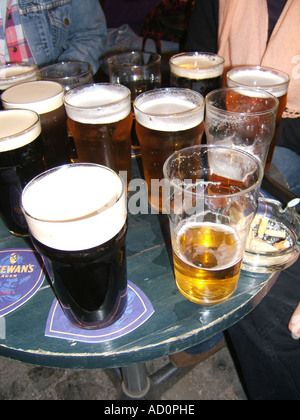 many pints of beer on pub table Stock Photo - Alamy