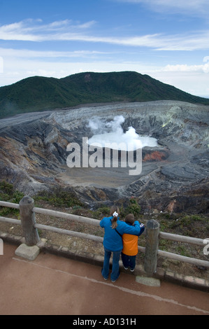 Tourists at the crater of Poas Volcano, Poas National Park, Costa Rica ...