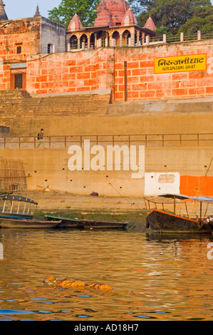A shrouded dead body floating down the river Ganges - a common site in ...