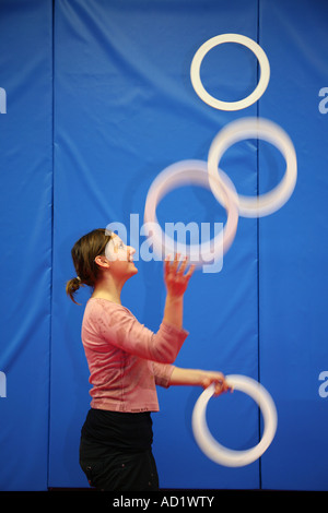 Girl juggling rings in the Hoxton circus space in London Stock Photo ...