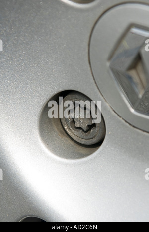 Locking wheel nuts on a renault clio car Stock Photo - Alamy