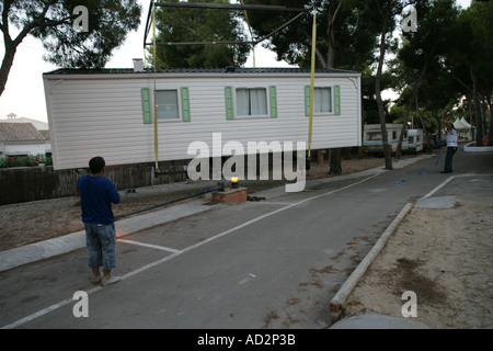 Lifting a static caravan into position Spain Stock Photo - Alamy