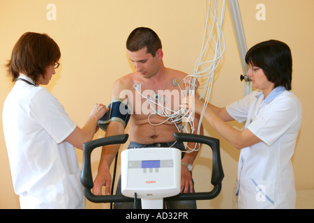 Female patient having ECG electrocardiogram in hospital. Woman patient ...