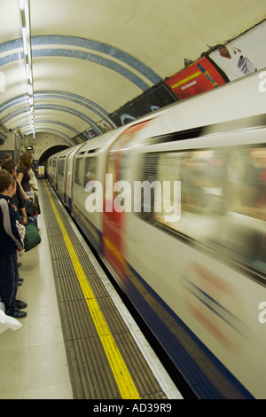 London Underground tube train speeding into Station with led departure ...