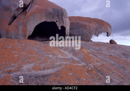 A photograph of smooth round granite rocks on a beach Stock Photo - Alamy