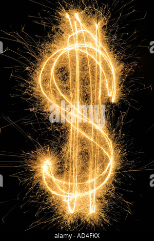 Illuminated dollar symbol with fireworks at night Stock Photo - Alamy