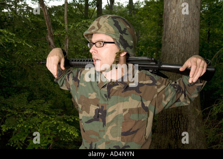 Soldier resting a gun across his shoulders Stock Photo - Alamy