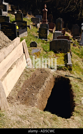 Freshly dug grave in a cemetery Stock Photo - Alamy