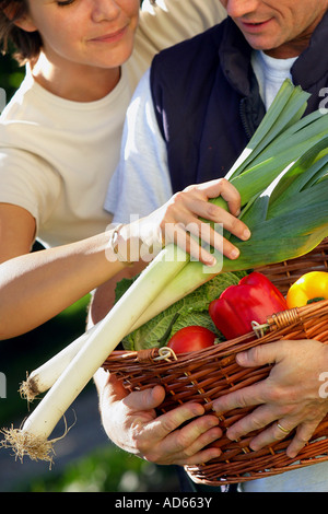 young woman carrying leeks Stock Photo - Alamy