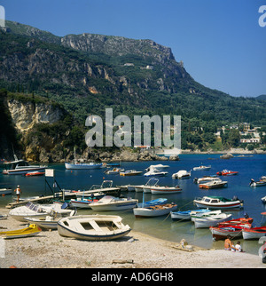 Alipa beach in Paleokastritsa bay with sand and crystal sea water ...