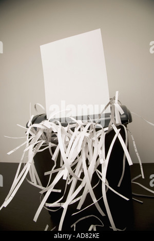 An Overflowing Paper Shredder Stock Photo - Alamy
