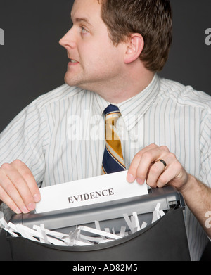 Man shredding evidence Stock Photo - Alamy