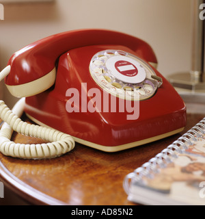 Red retro telephone on bright background Stock Photo - Alamy