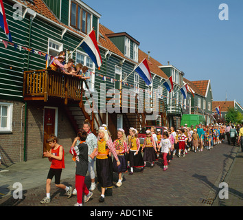 People on Marken in traditional costumes with the reformed church in ...