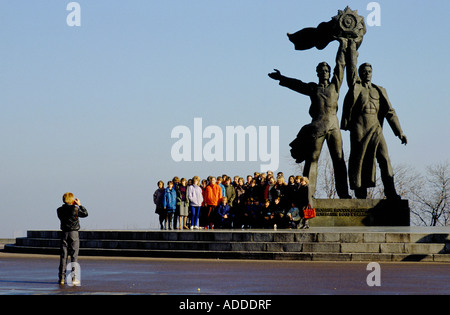 A group of students stand beside the Statue of Friendship in Kiev, Oct ...
