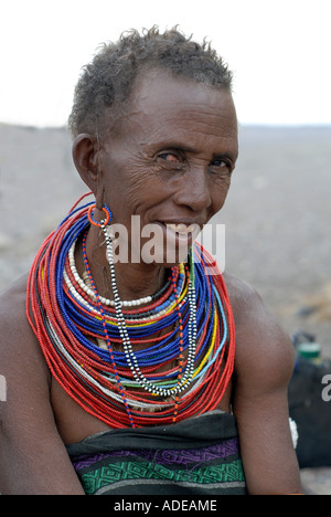Elderly El Molo woman with traditional tribal decorations Lake Turkana ...