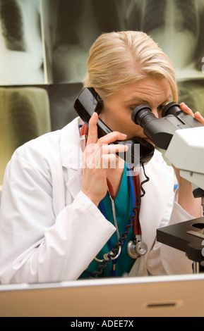 Doctor with phone calls in the laboratory Stock Photo - Alamy