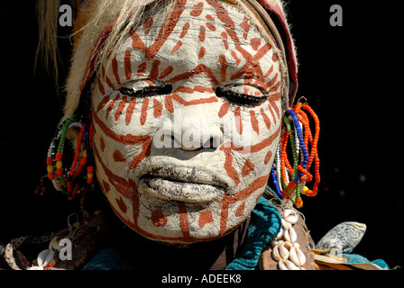 Kikuyu tribeswoman with traditionally painted face and bead decorations ...