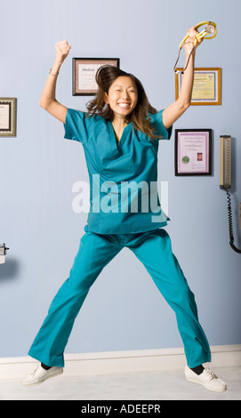 happy nurse jumping Stock Photo - Alamy