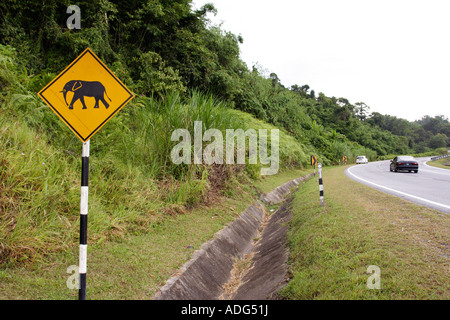 Wild elephant crossing signboard in Malaysia Stock Photo - Alamy