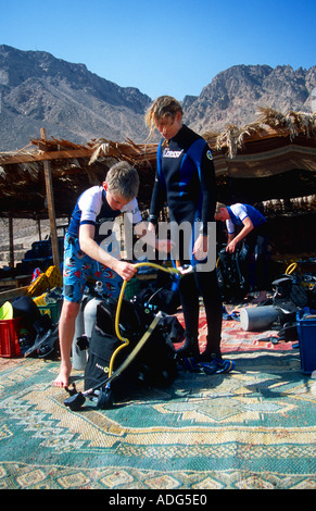 Boys getting ready for scuba dive Junior Open Water Lighthouse Reef ...