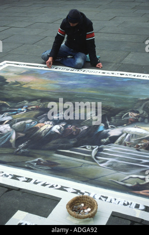 Young artist begging at the street Stock Photo - Alamy