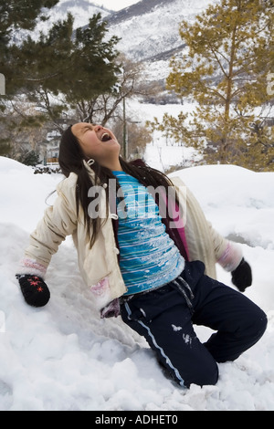 Girl with snow falling down her shirt Stock Photo - Alamy