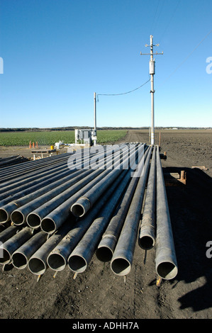 Laying out farm water pipes for water tractor irrigation in dry parts ...