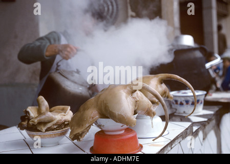 Cooked skinned dogs outside restaurant China Stock Photo - Alamy