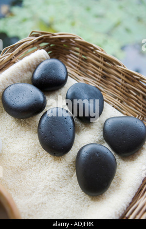 spa pebbles on a basket Stock Photo - Alamy