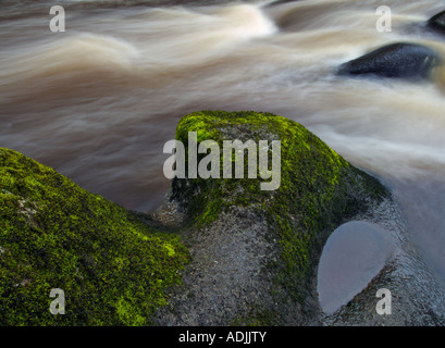 Curved rocks and flowing water abstract Stock Photo - Alamy